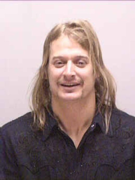 40 Celebs Smiling In Their Mugshots (PHOTOS)